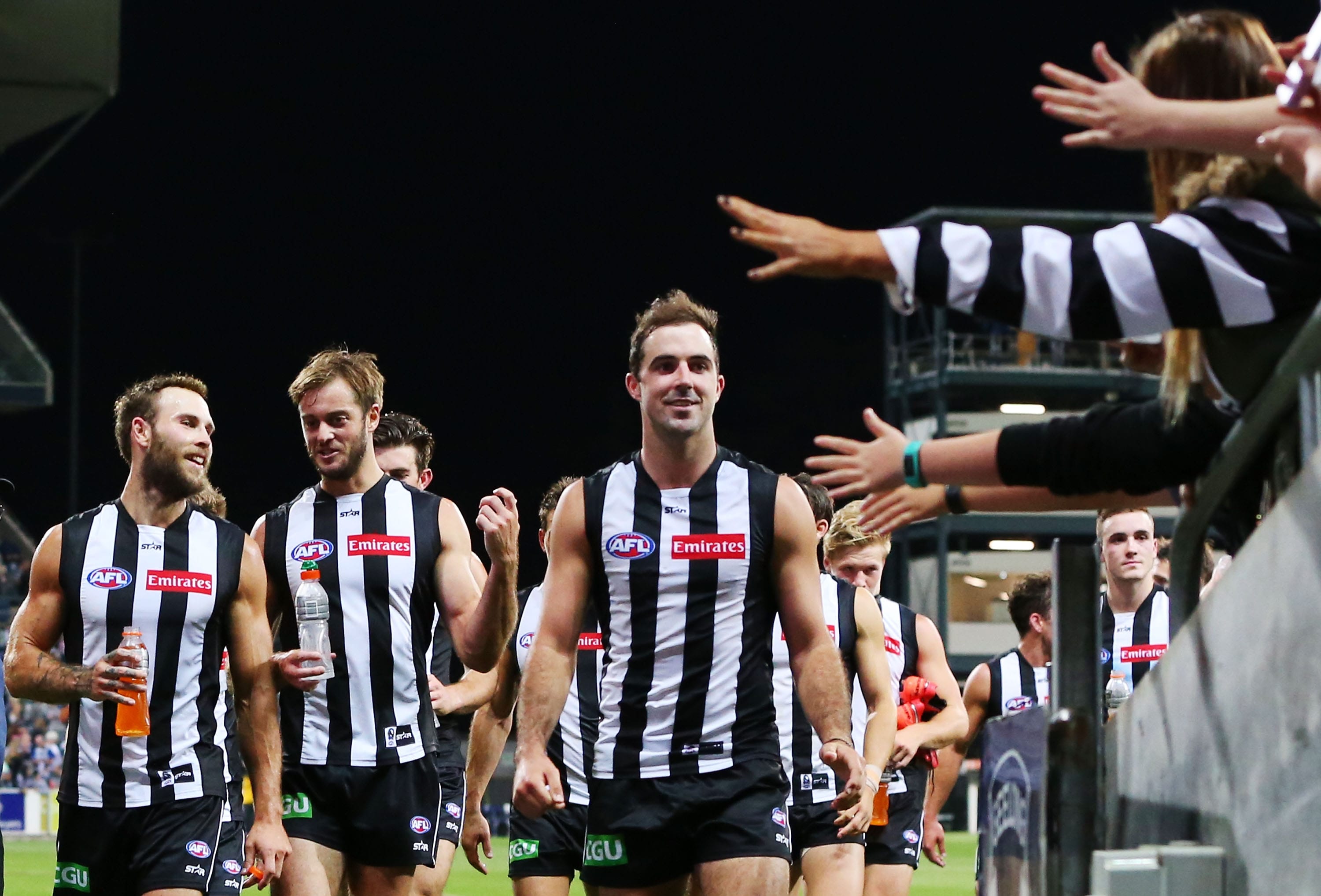Collingwood signs four players to new deals