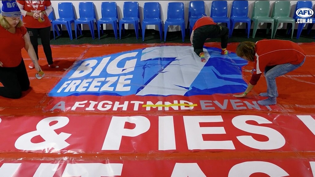 Hang on, Swannies: Cheer squad's cheeky touch to Dees-Pies Fight MND banner