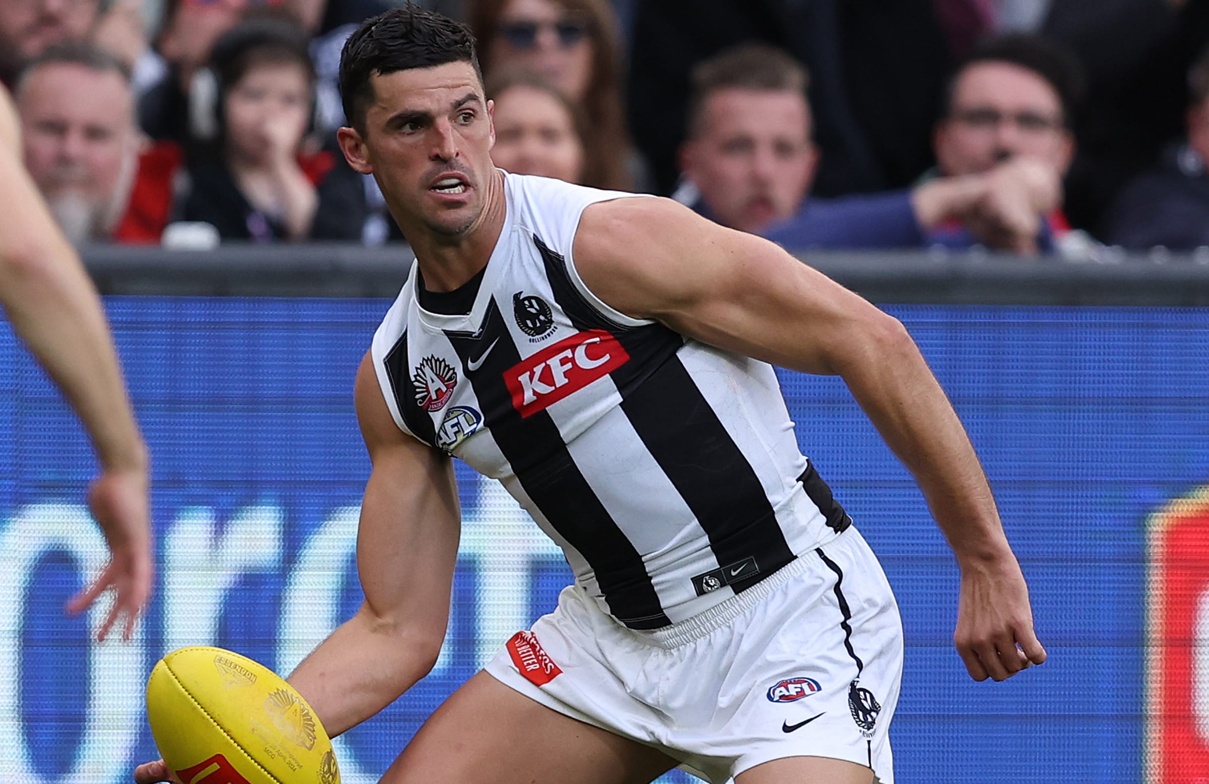 Ball magnet: Pies great makes history on Anzac Day stage