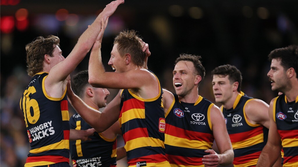 Strachan swarmed as first AFL goal lifts spirits