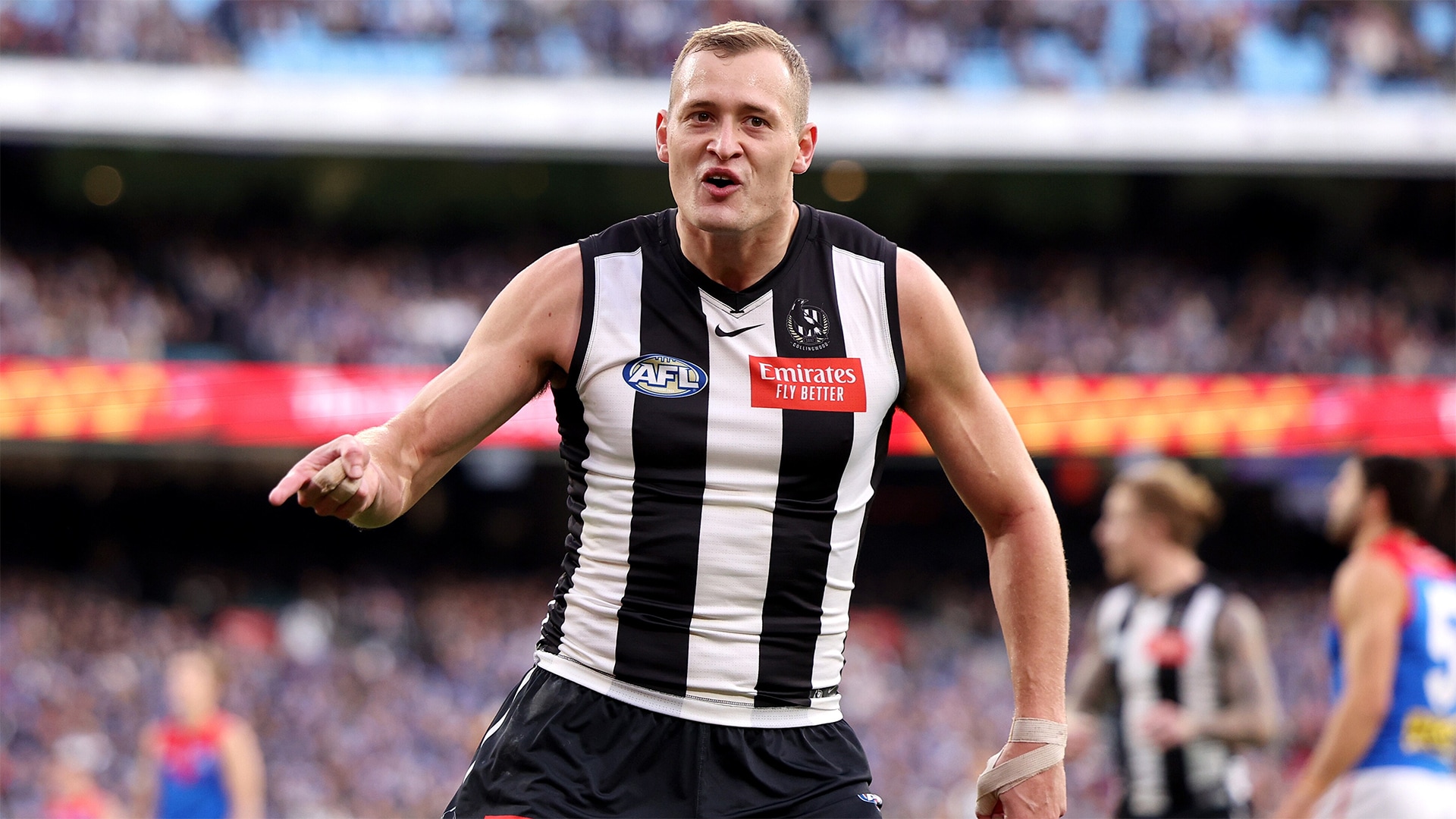 Pies fly into top eight as Dees lose Trac