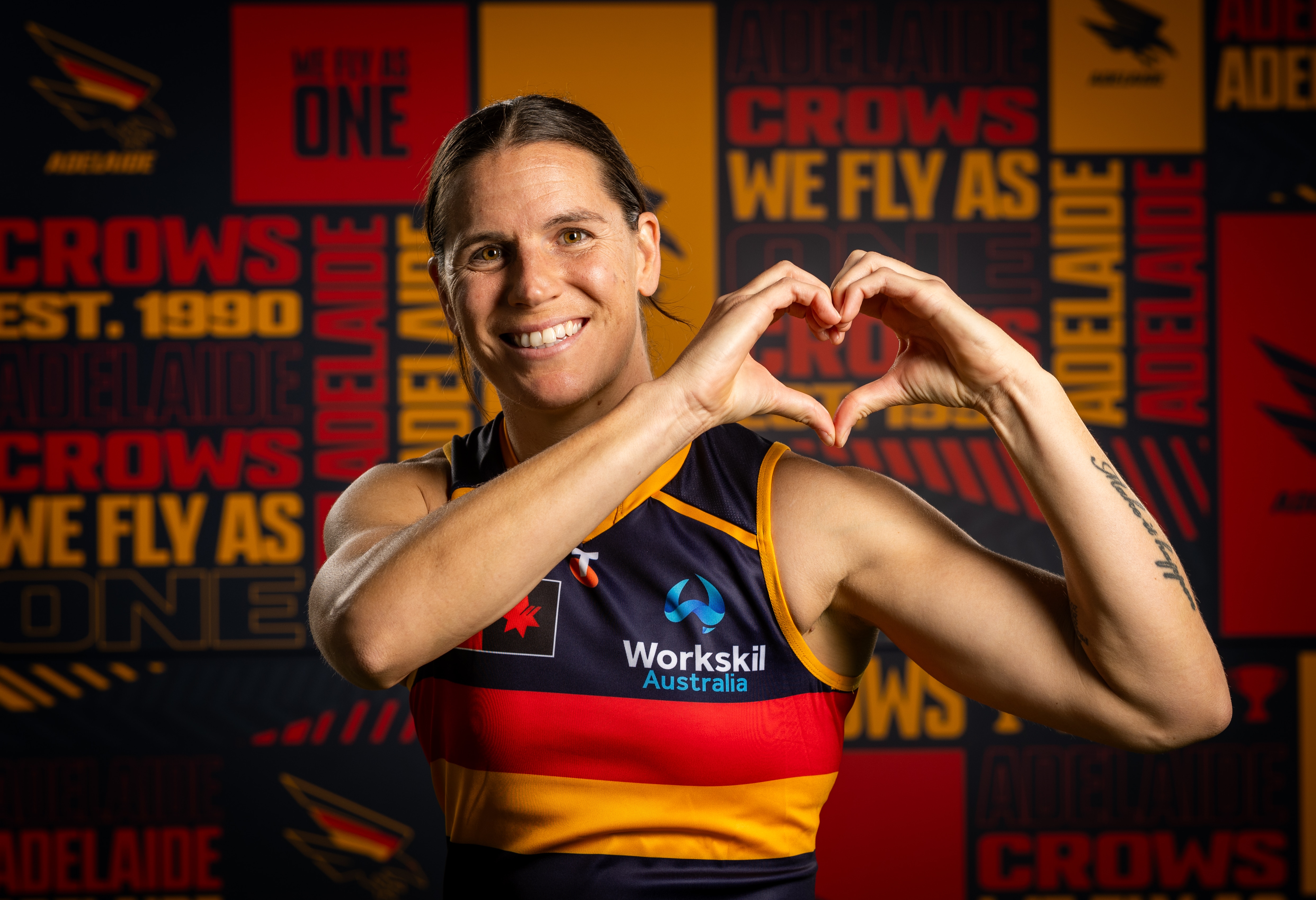Crows champion spurns rival interest to sign on for two more years