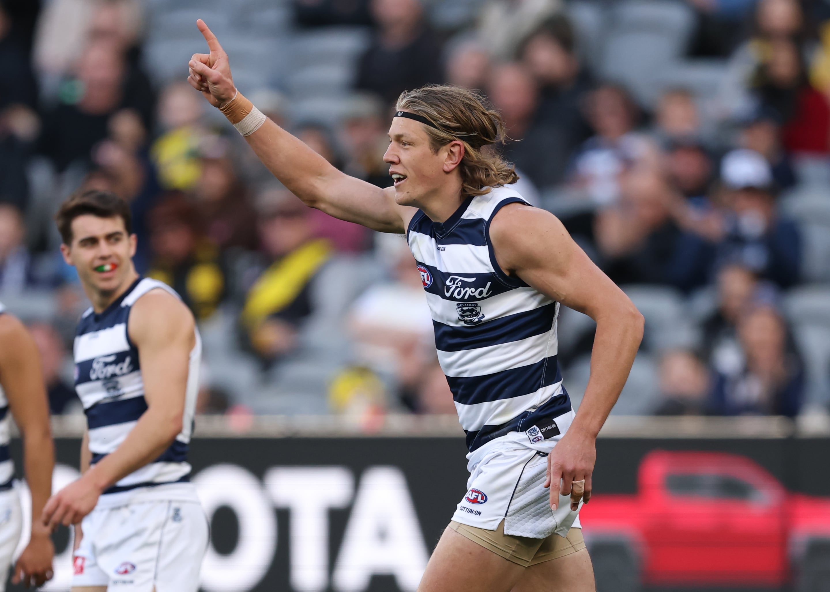 Cats secure top-two spot after disposing of plucky Tigers