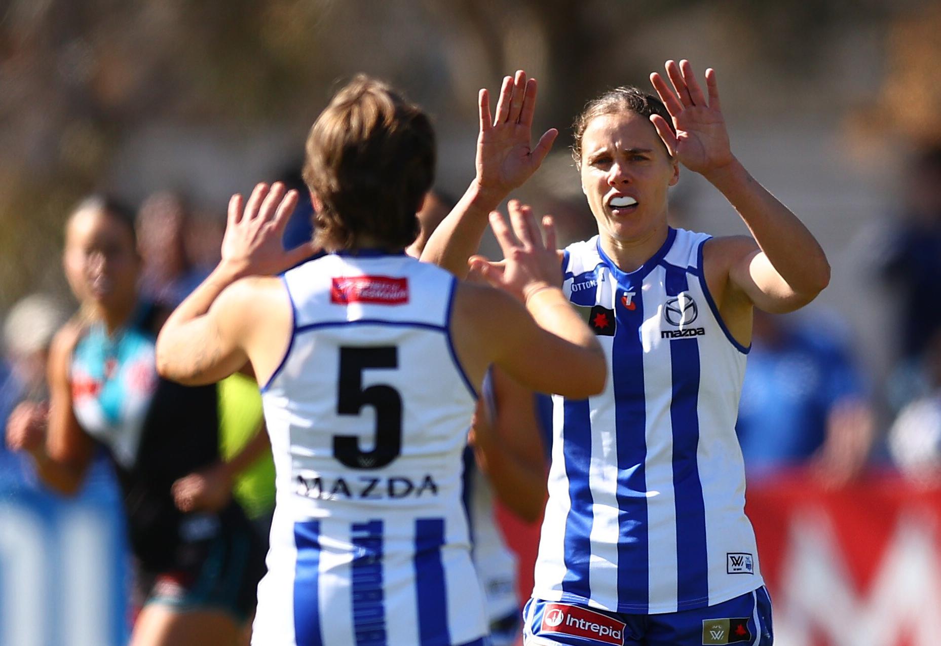 Garner boots six as rampaging Roos unfurl flag before blowing Power away