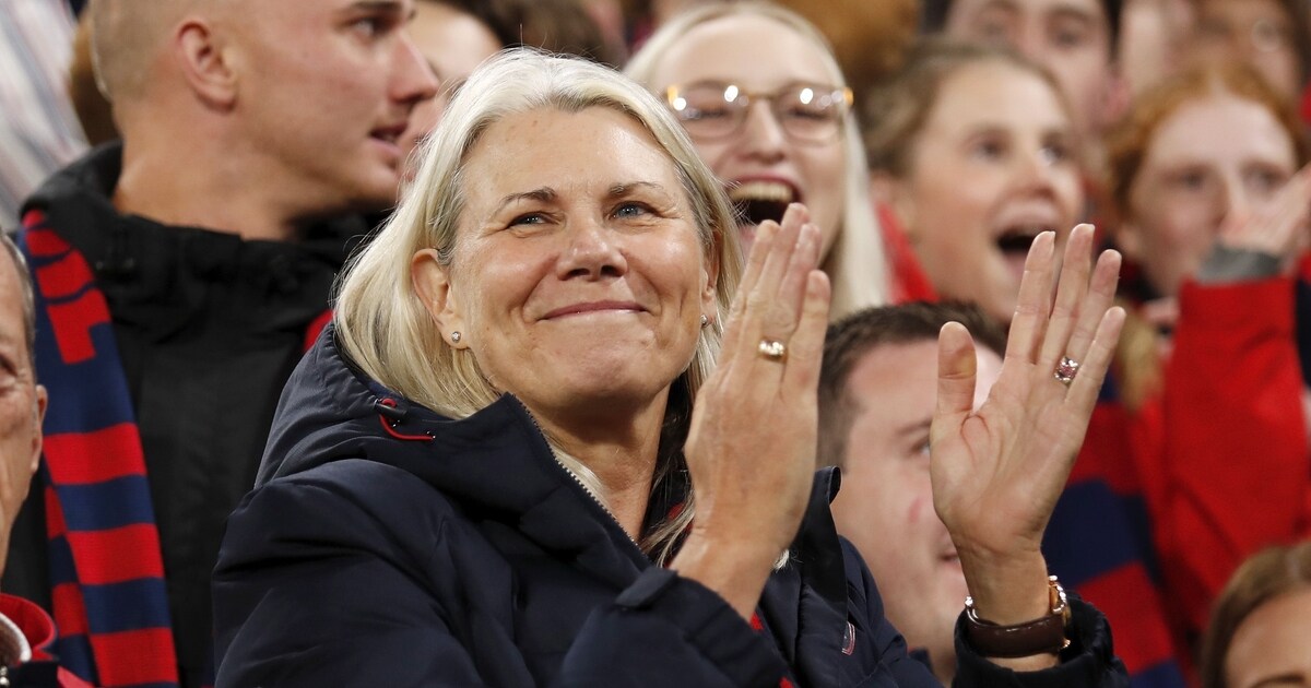 AFL Commission Chairman Richard Goyder congratulates Kate Roffey