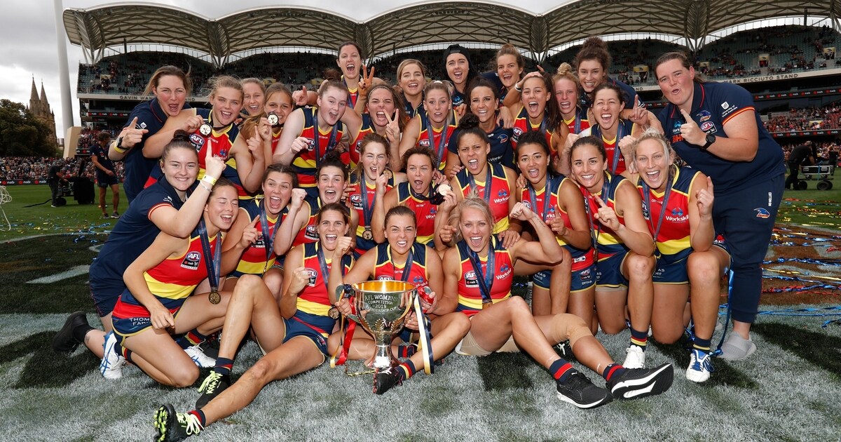 Crows soar to flag in front of record crowd, but injury hits superstar