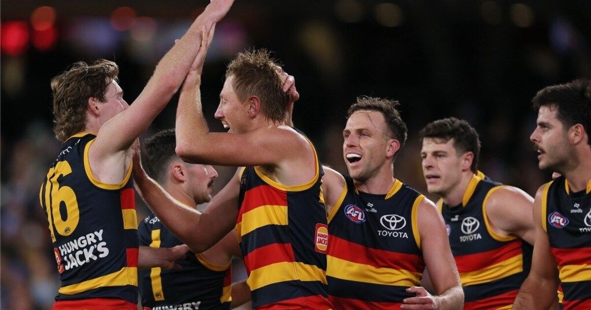 Strachan swarmed as first AFL goal lifts spirits